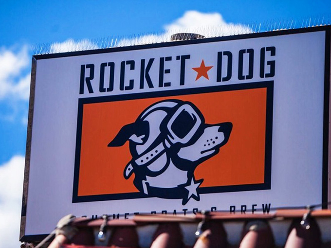 The cosmic canine himself stands guard over this Fresno institution, beckoning hungry travelers with promises of out-of-this-world flavor experiences.