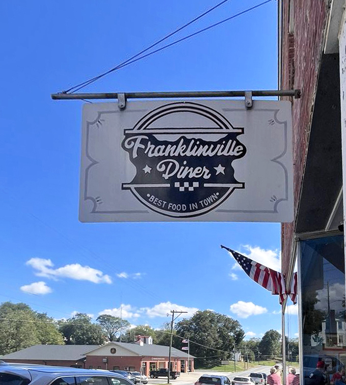 The sign says "BEST FOOD IN TOWN" against the Carolina blue sky—a bold claim backed up by every plate that leaves the kitchen.