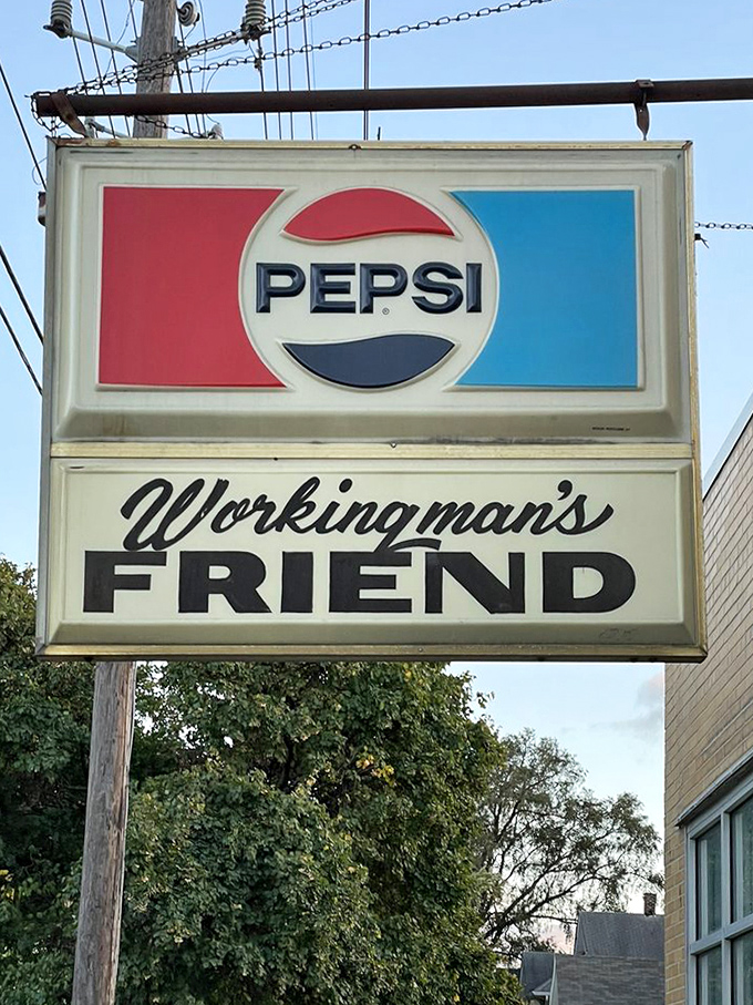 The vintage Pepsi sign stands as a neighborhood landmark. It's not just advertising—it's a beacon guiding hungry travelers to burger nirvana.