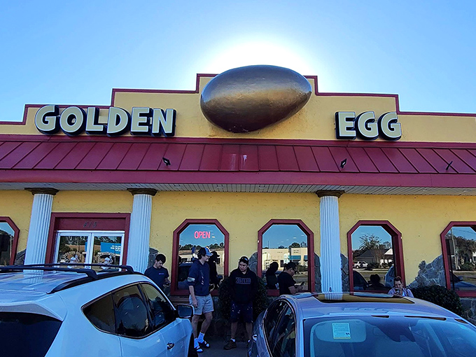 When the morning sun hits that golden egg sign just right, it becomes a breakfast lighthouse guiding hungry souls to pancake harbor.