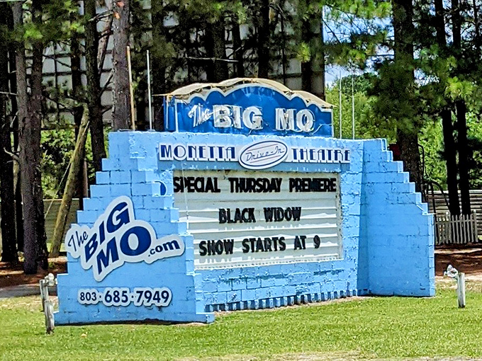 The Big Mo's bright blue sign announces tonight's feature with the same excitement your grandparents might have felt decades ago.