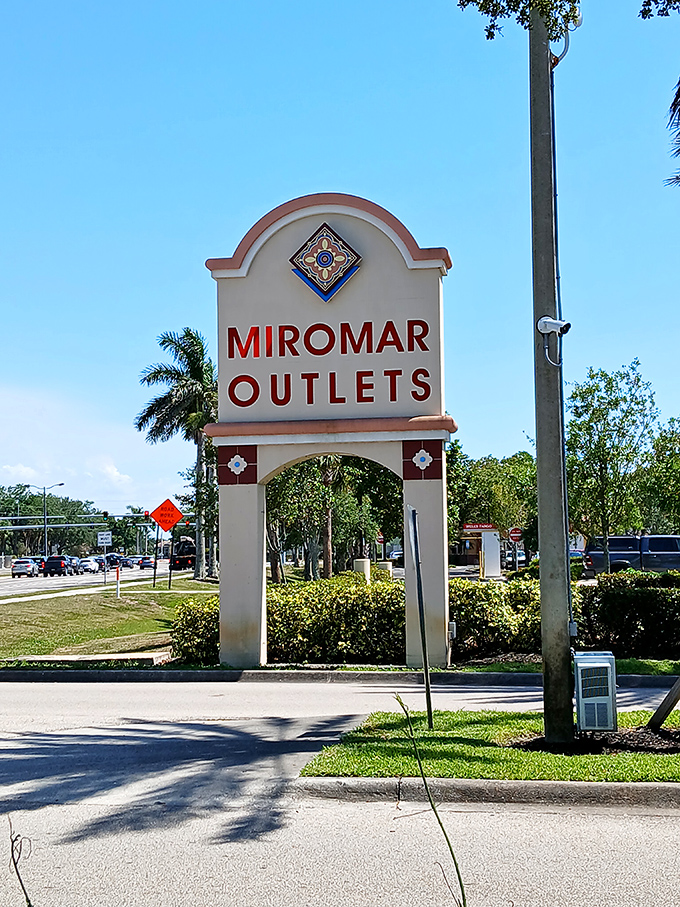 The iconic entrance sign stands like a retail lighthouse, guiding bargain hunters safely to discount shores.