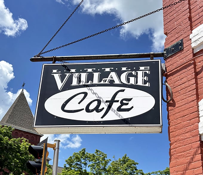 That classic hanging sign against Baraboo's blue sky promises more than just a meal&mdash;it's an invitation to discover Wisconsin's most surprising cafe.