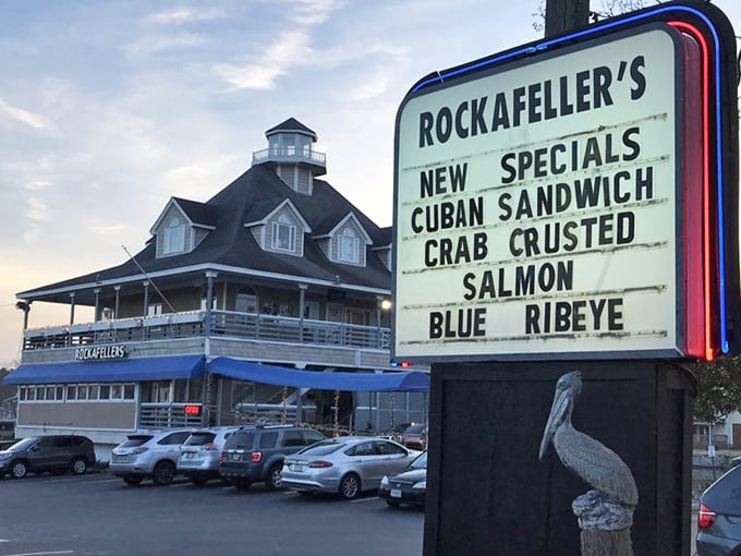 The roadside sign announces daily specials like a town crier, while the restaurant stands proudly in the background&mdash;a lighthouse for hungry travelers.