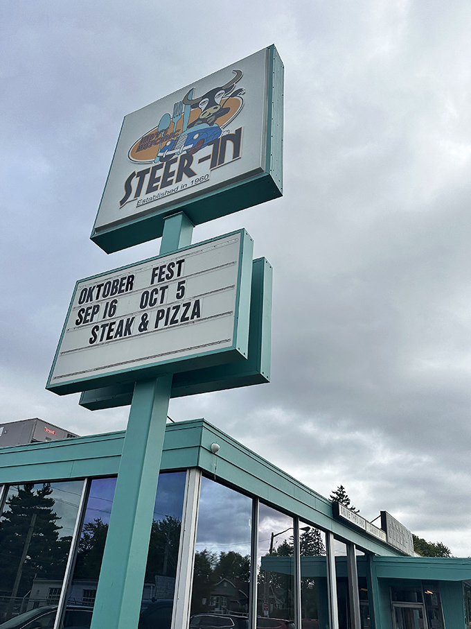 The roadside beacon that's guided hungry travelers for generations. That turquoise sign promises relief for empty stomachs and weary souls.