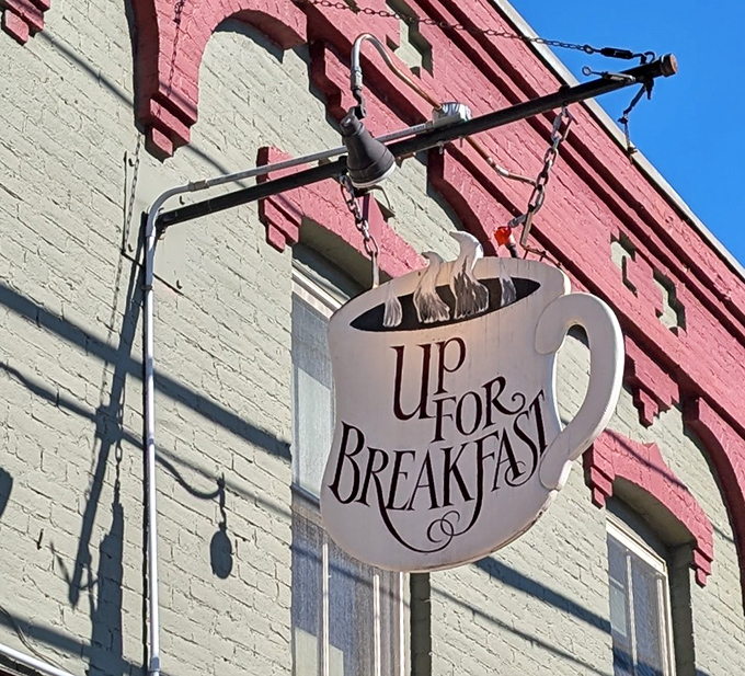 The iconic coffee cup sign swinging above Manchester Center's sidewalk&mdash;a beacon of breakfast hope for the hungry and caffeine-deprived.