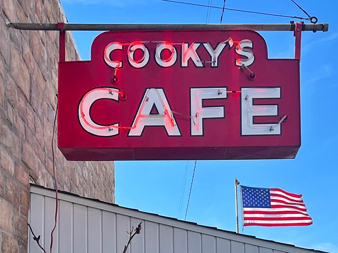 That vintage sign hanging proudly against blue sky represents decades of home cooking done right in Golden City.