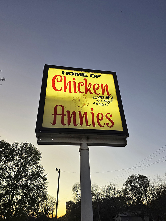 "Something to CROW about!" proclaims the illuminated sign, a beacon of hope for hungry travelers seeking salvation in perfectly fried poultry.