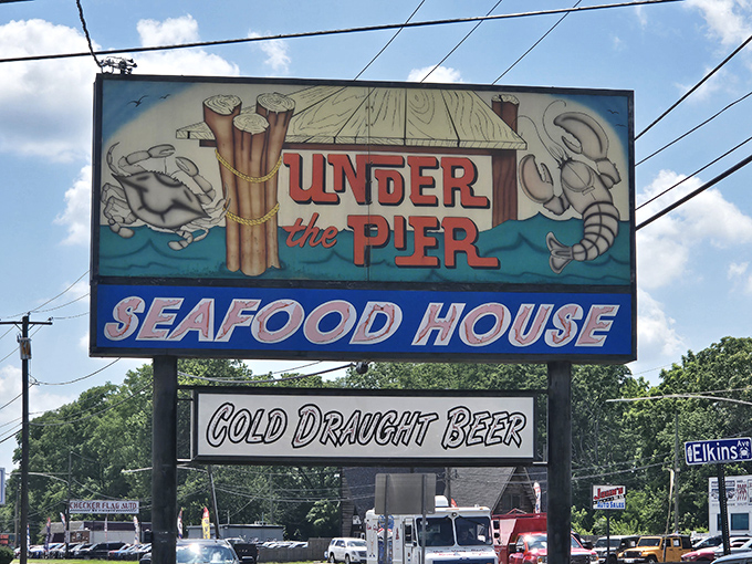 The roadside sign promises exactly what awaits: seafood and cold beer. In a world of complicated choices, Under the Pier keeps it refreshingly simple.