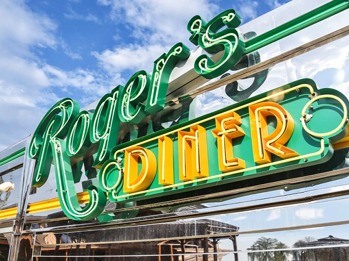 The neon sign glows like a beacon of hope for the hungry traveler &ndash; green and gold letters spelling out "salvation for empty stomachs."
