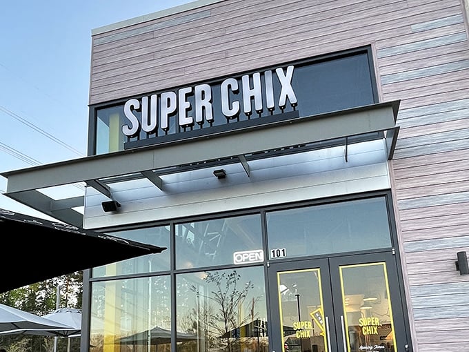 The Super Chix sign stands as a beacon of hope for the hungry, promising salvation in the form of perfectly fried poultry just beyond those doors.