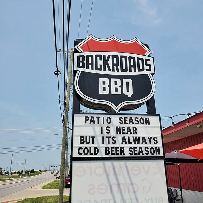 A sign with the wisdom of Solomon. When is cold beer season? Always. When is BBQ season? Also always.