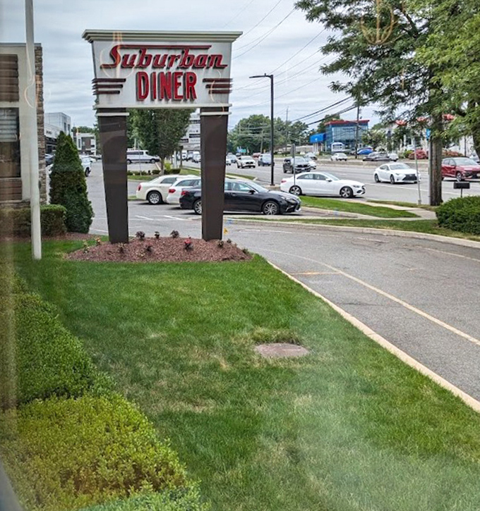 The iconic Suburban Diner sign stands as a landmark in Paramus, promising refuge from cooking your own meals and judgment-free second cups of coffee.