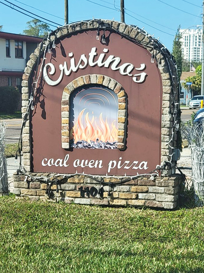 That iconic sign says it all&mdash;coal-fired pizza awaits. Like a beacon to the pizza-obsessed, it promises fiery deliciousness just steps away.