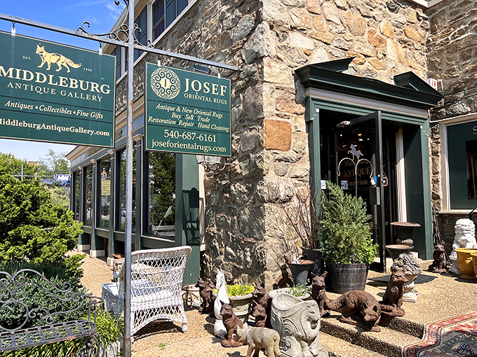 The welcoming entrance where garden statuary and outdoor antiques bask in Virginia sunshine, tempting passersby to explore treasures within.