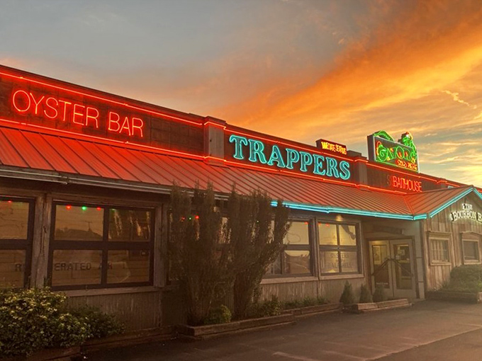 The sunset view of Trapper's could be a postcard captioned "Wish you were here eating seafood with me." The neon "OYSTER BAR" sign is practically a siren call.