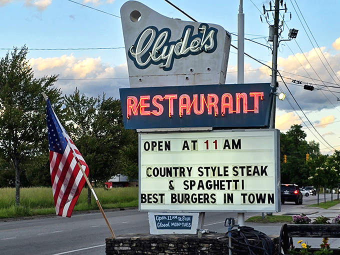 The vintage roadside sign glows against the Carolina sky, promising "Best Burgers in Town" with the confidence that comes from decades of delivering on that promise.