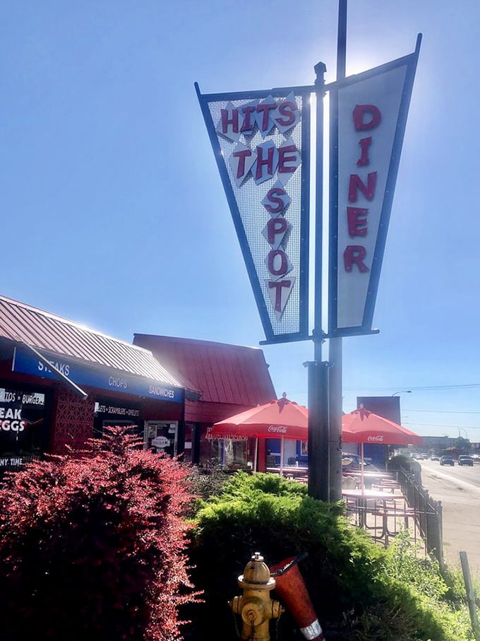 Not all heroes wear capes—some come in the form of mid-century signage promising breakfast salvation just off the highway.