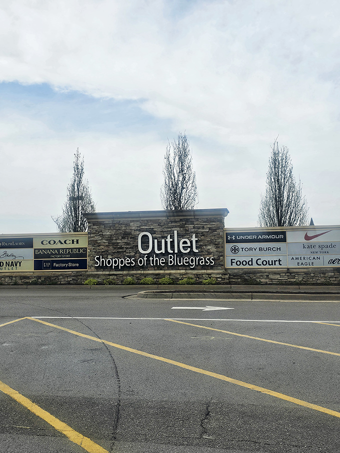 The stone monument of savings announces your arrival at the promised land, where designer labels meet markdown magic.