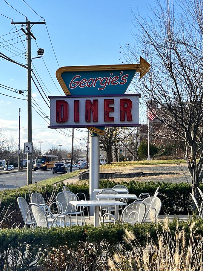 That classic neon sign doesn't just say "Georgie's Diner" &ndash; it screams "comfort food ahead" in the universal language of hungry travelers.