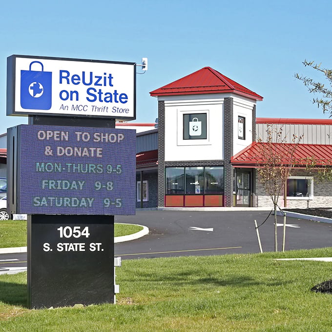 The digital sign announces hours and welcomes shoppers to ReUzit on State. This modern thrift mecca proves secondhand shopping has entered the 21st century.