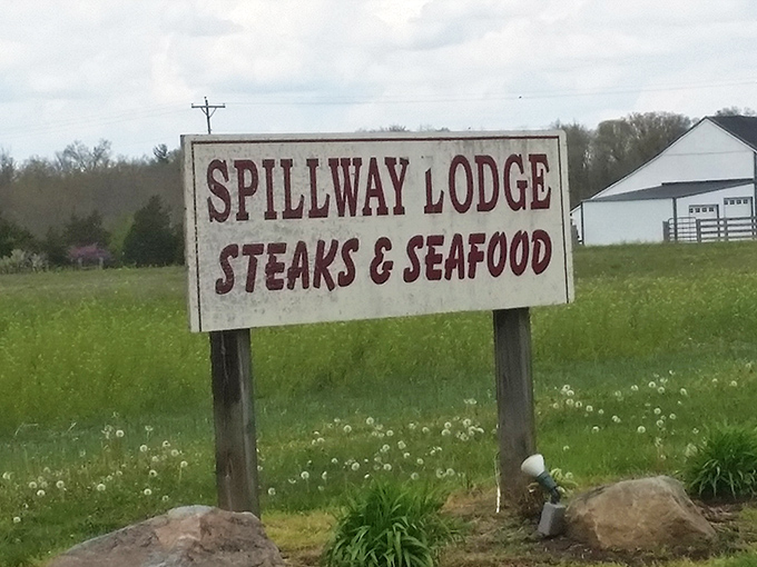 The roadside sign stands as a beacon of hope for hungry travelers. Simple, straightforward, and making a promise that the kitchen absolutely keeps.