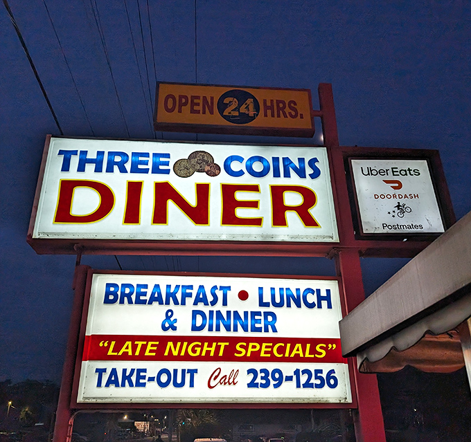 A sign that promises three essential things: they're open 24 hours, they serve three square meals, and yes, they'll feed you at 3 AM without judgment.