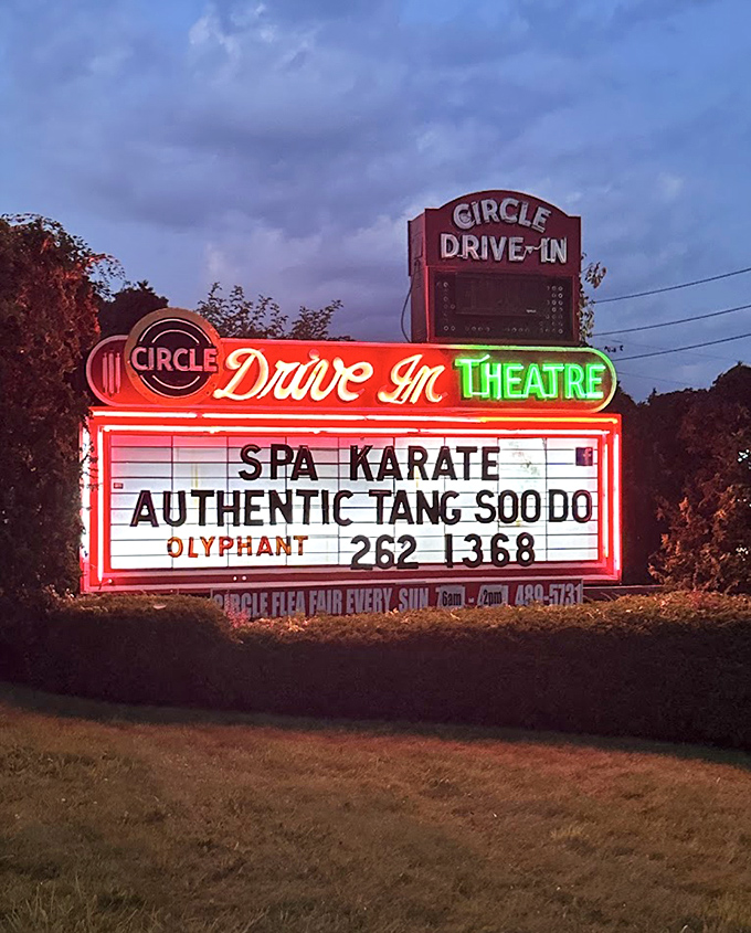The neon marquee glows like a beacon in the Pennsylvania night, its vintage lettering a reminder that some things improve with age.