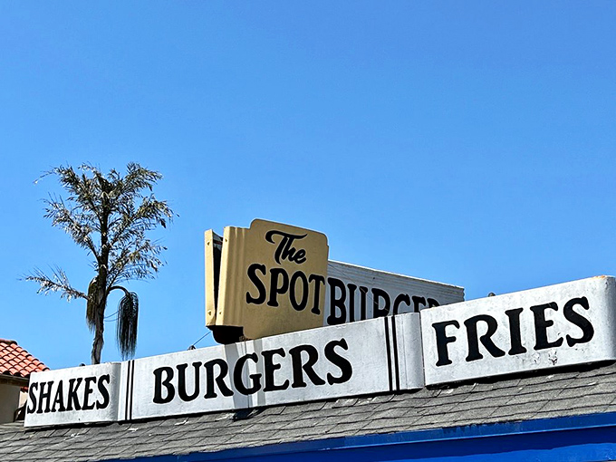 The iconic signage promises exactly what it delivers: shakes, burgers, and fries done right.
