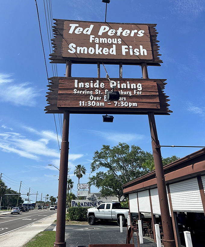 The weathered wooden sign stands like a beacon of hope for hungry travelers&mdash;promising smoked fish salvation just off Pasadena Avenue.