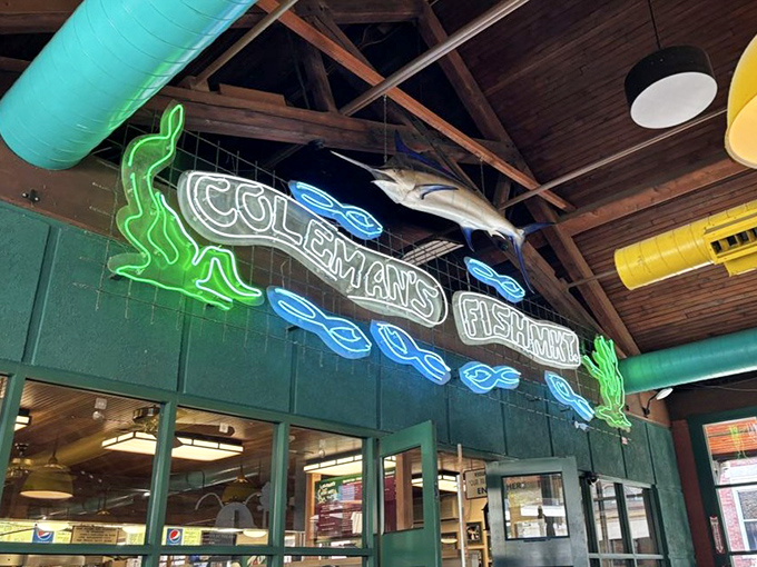 The full glory of Coleman's neon signage, where the green frog and blue fish dance around the name like happy memories around a good meal.