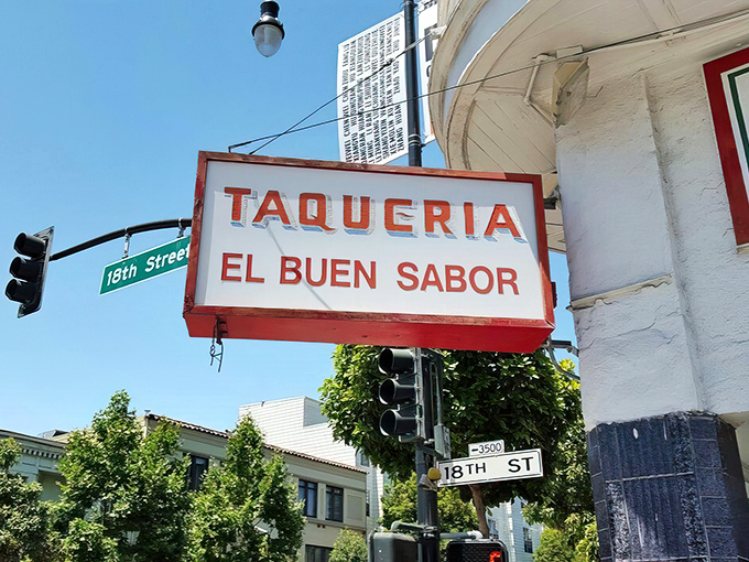 The corner signage proudly announces "El Buen Sabor" – three words that translate roughly to "You're about to have the best lunch of your week."