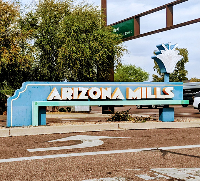 The Arizona Mills sign stands as a beacon for bargain hunters, marking the spot where "just running in for one thing" becomes a three-hour shopping marathon.