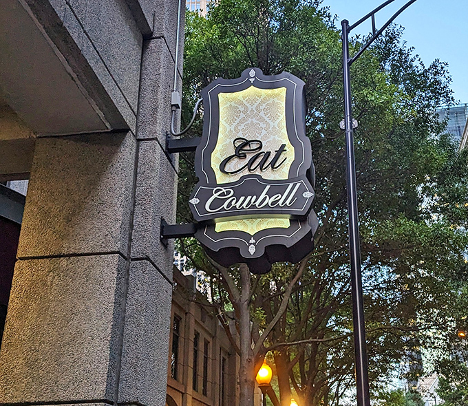 "Eat Cowbell" isn't just a sign&mdash;it's life advice worth following. This elegant street marker guides hungry pilgrims to burger salvation.