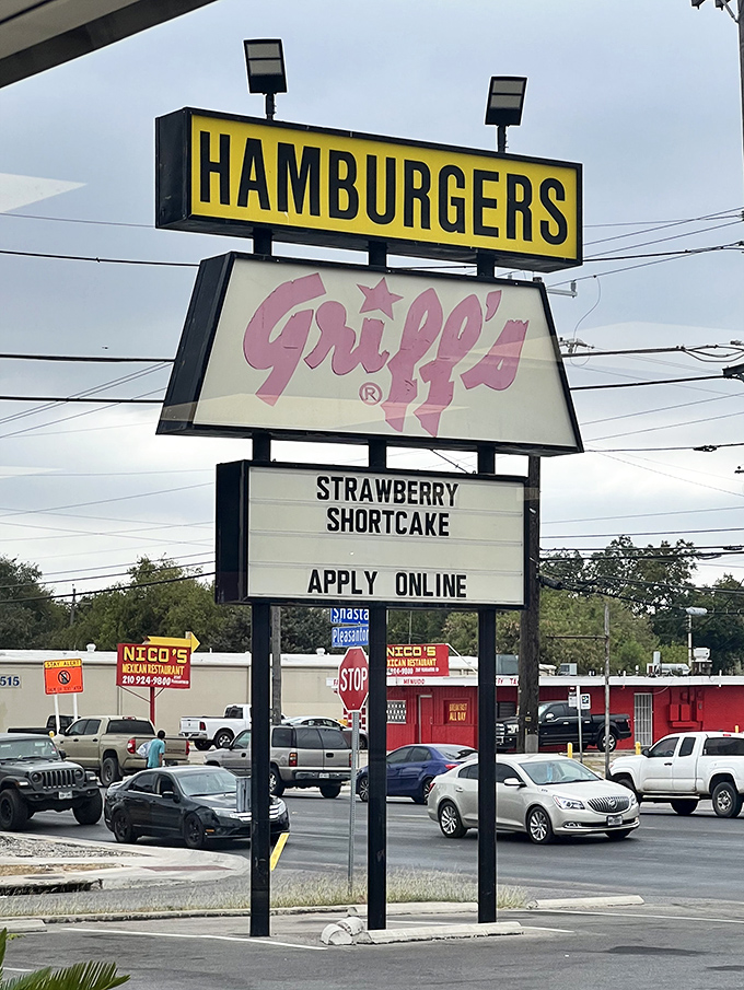 Close-up of the legendary sign—part of the Texas fast food landscape as essential as bluebonnets in spring. A pink script promise of satisfaction.