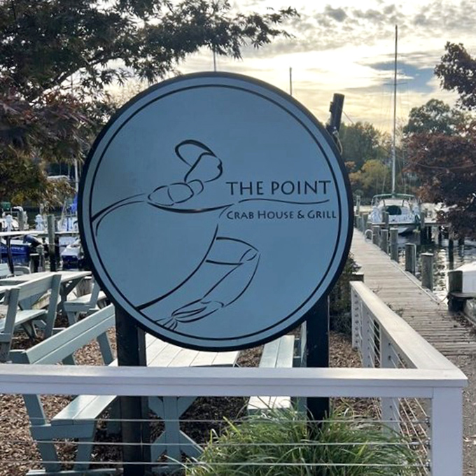 The circular logo captures The Point's essence&mdash;hands presenting the bounty of the Chesapeake. A simple symbol for an extraordinary dining experience.