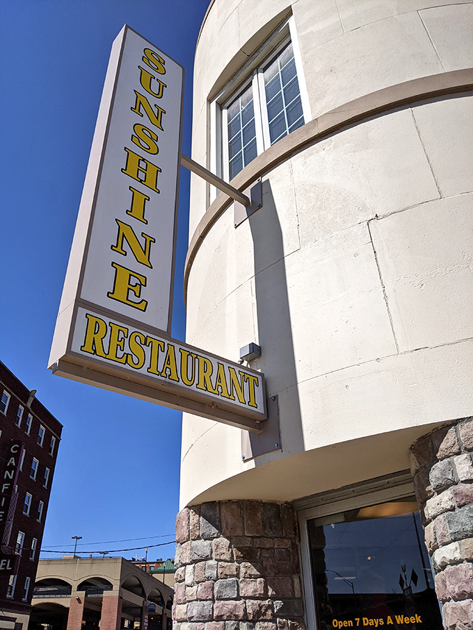 The vertical promise of "SUNSHINE" against a blue Iowa sky&mdash;a siren call to hungry travelers that good things await inside.