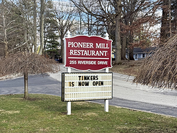 The roadside sign announces your arrival at Pioneer Mill, where culinary adventures await just beyond those historic brick walls.