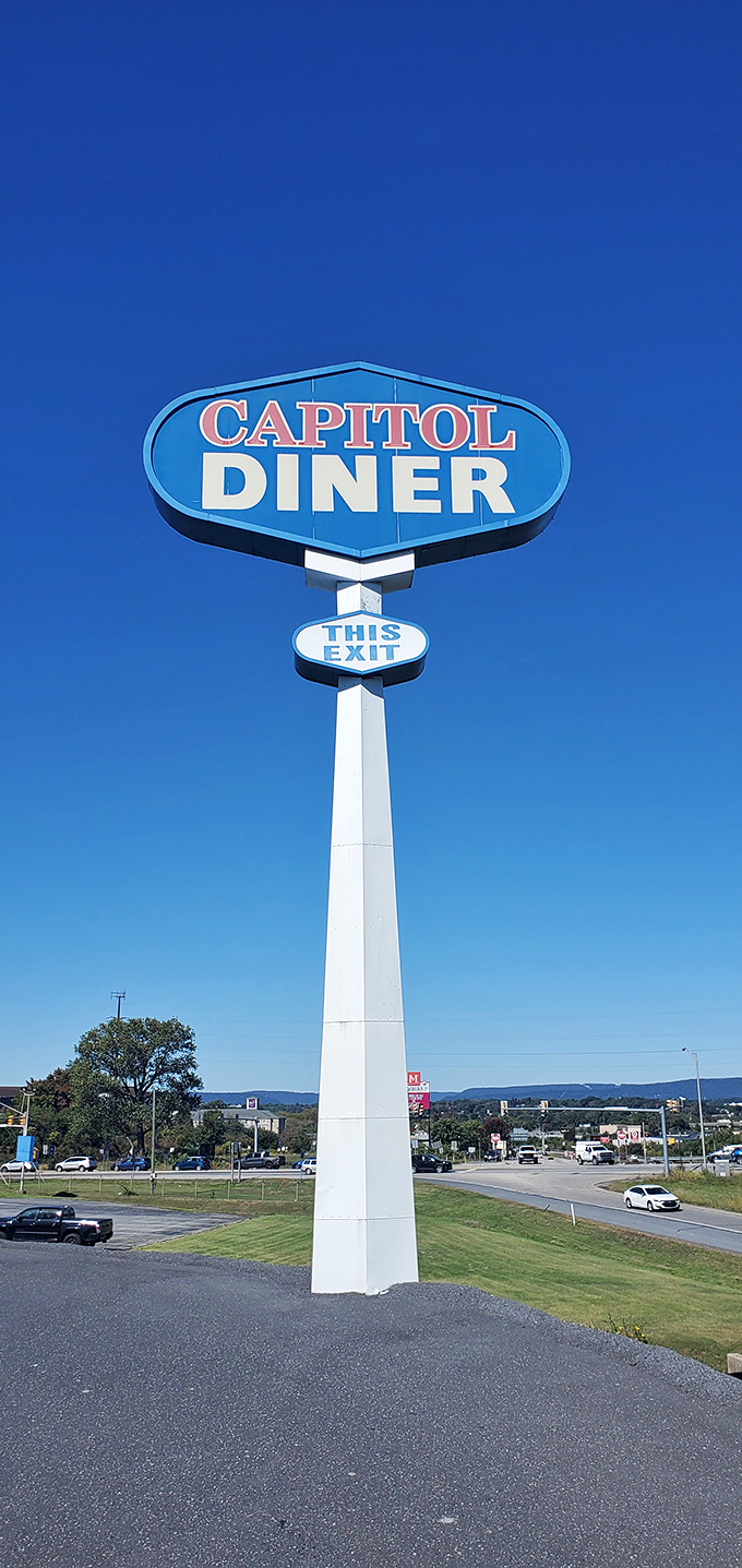 The roadside sign stands tall against the Pennsylvania sky, a North Star for hungry travelers seeking breakfast salvation.