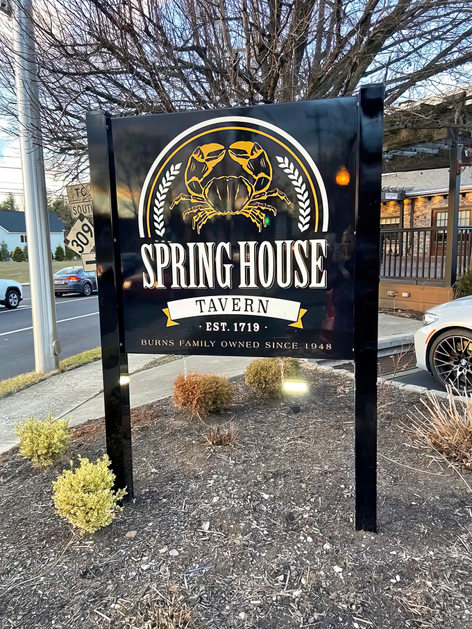 The roadside sign proudly displays the tavern's heritage&mdash;established 1719, with a golden crab emblem that hints at treasures waiting on the menu inside.