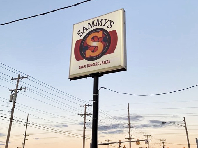 The Sammy's sign against a twilight sky &ndash; a beacon of hope for the hungry traveler and a promise of deliciousness to come.