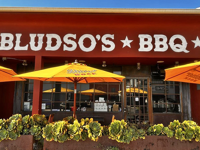 That red façade isn't just a color choice—it's a warning sign that what happens inside might forever change your barbecue standards.