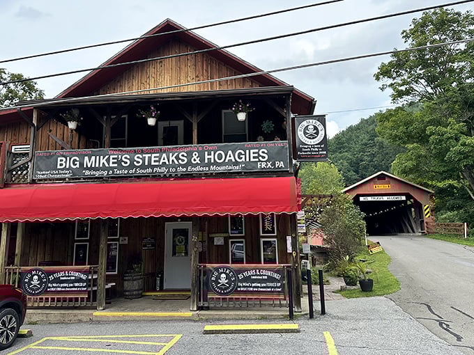The wooden exterior with its iconic red awning sits perfectly against the backdrop of Pennsylvania's rolling hills &ndash; a sandwich shop that belongs exactly where it is.