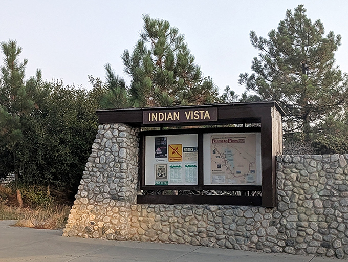 The unassuming gateway to wonder&mdash;this stone and wood information kiosk marks the threshold between ordinary day and extraordinary experience.