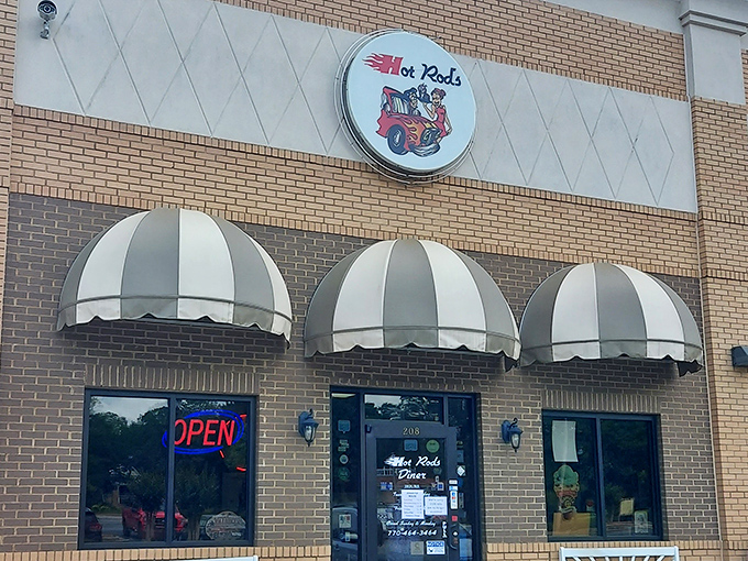 That vintage sign promises exactly what awaits inside: a slice of Americana served with a side of nostalgia and zero pretension.
