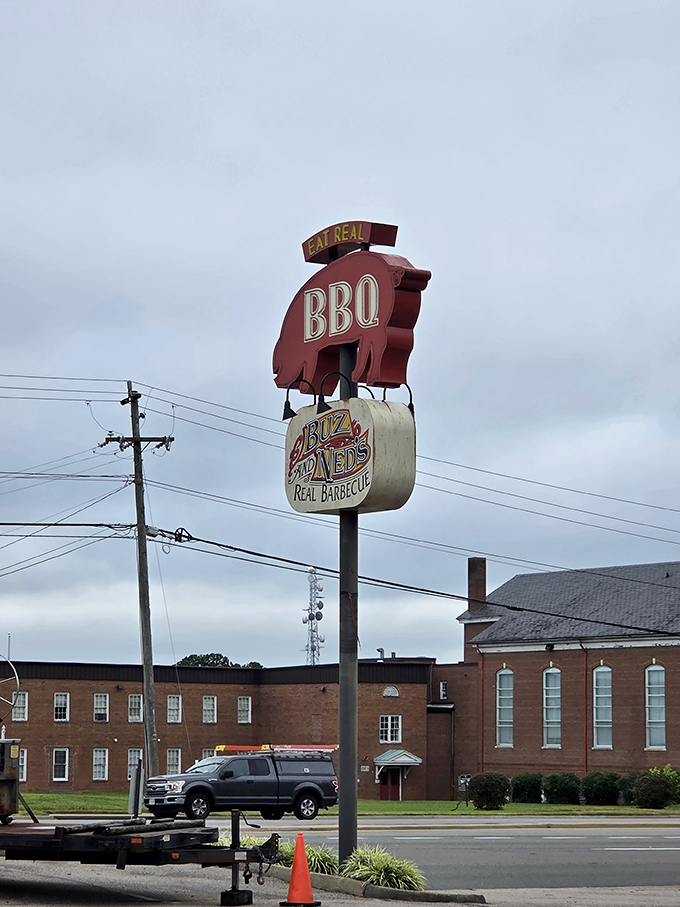 The iconic pig sign holding barbecue sauce stands tall, making highway navigation unnecessary &ndash; just follow your nose toward smoke.