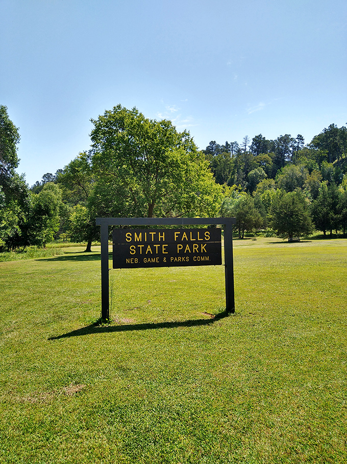 The unassuming entrance sign that promises little but delivers one of Nebraska's most spectacular natural performances.
