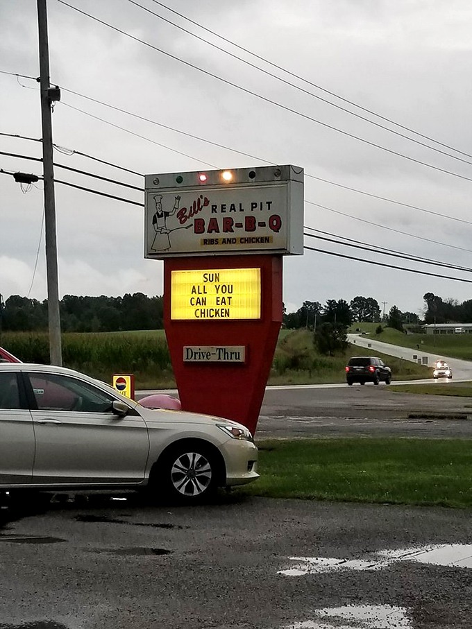 The illuminated sign announces daily specials like breaking news. "All you can eat chicken" might be the four most beautiful words in English.