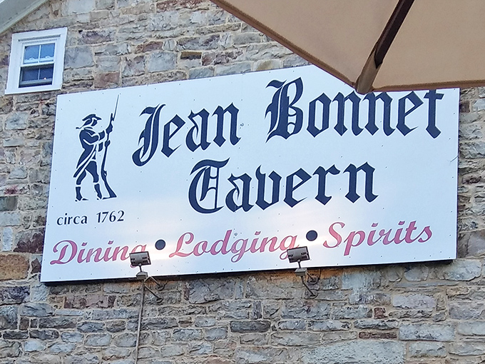 The sign says it all: since 1762, offering weary travelers dining, lodging, and spirits&mdash;though the spirits might be both the bottled and ghostly variety.