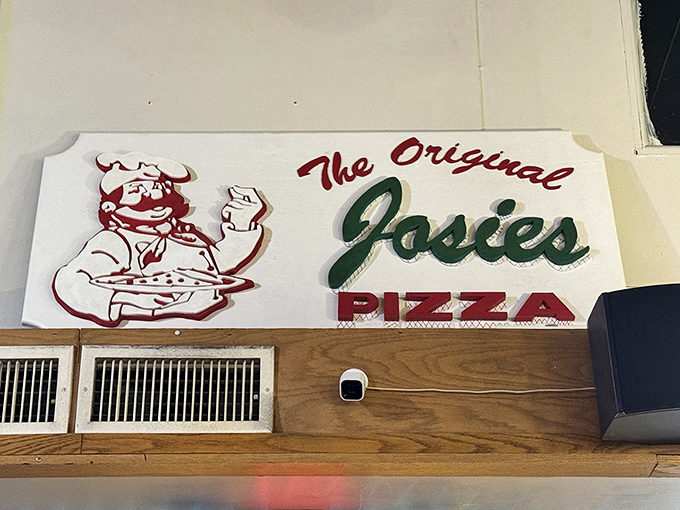 The mascot watching over diners like a benevolent pizza guardian&mdash;part chef, part cartoon, all business when it comes to your hunger.